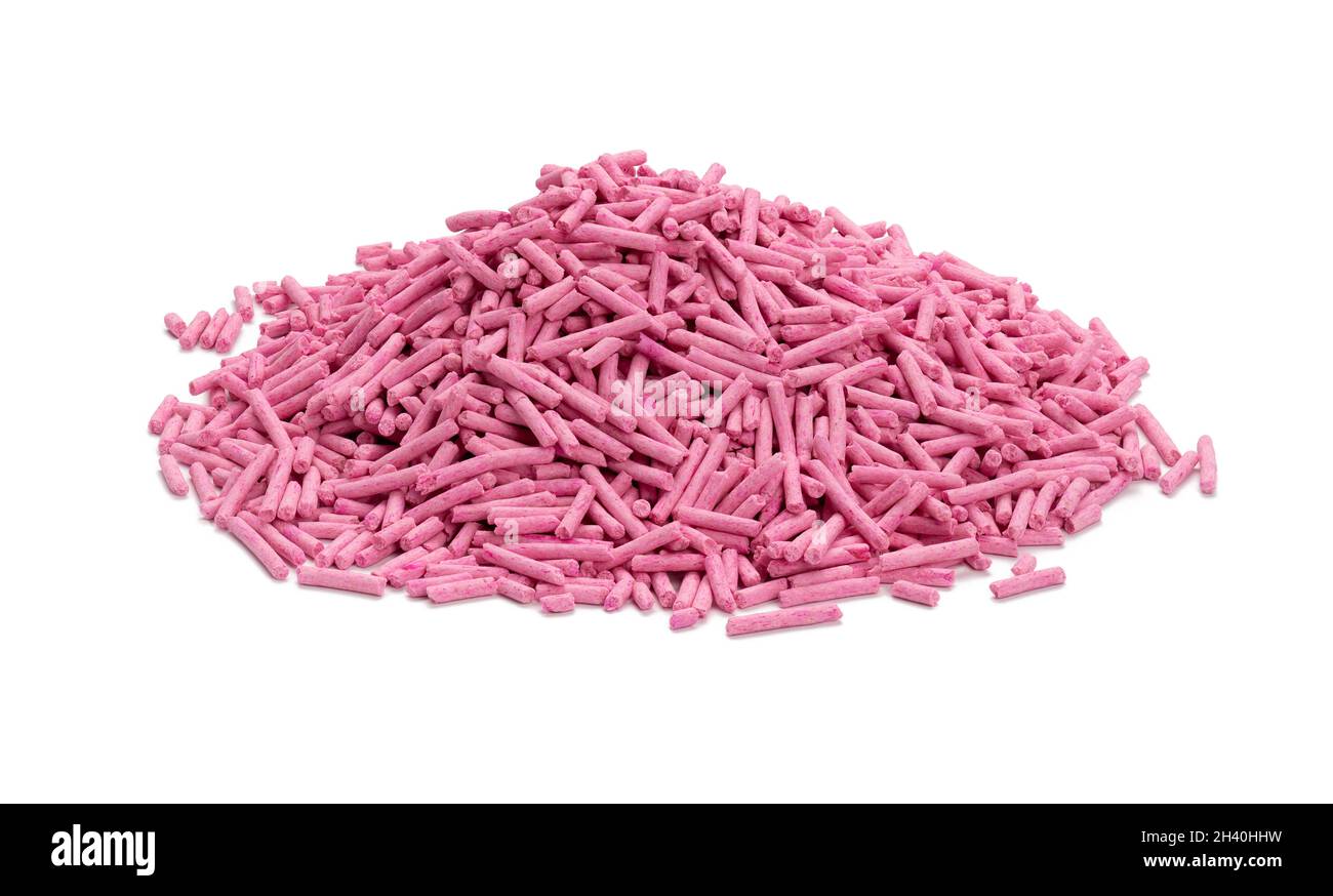 Pile of pressed pink cat litter isolated on white background. Granules ...