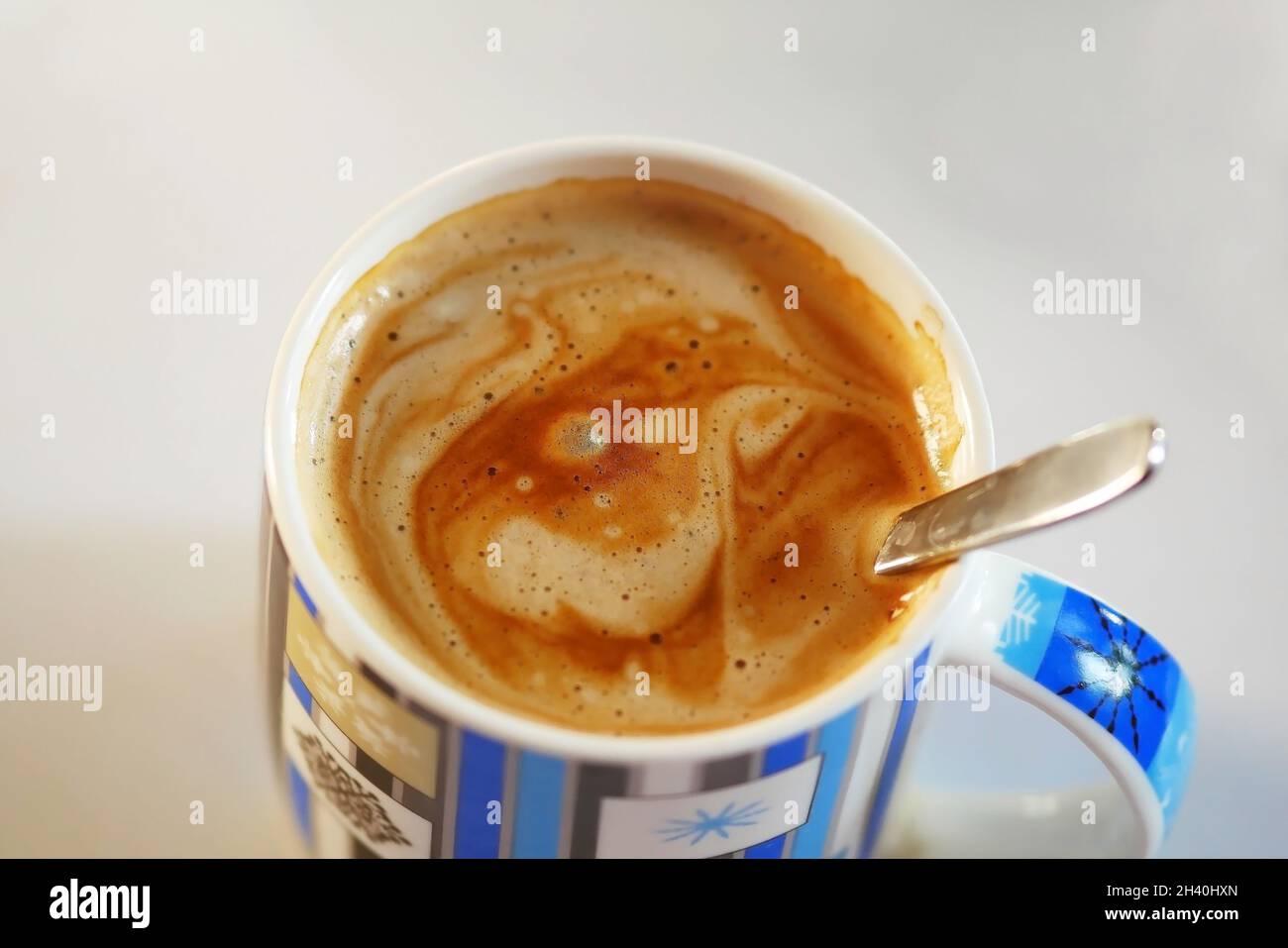 Good morning! Blue cup of coffee on a bright background. Coffee with ...
