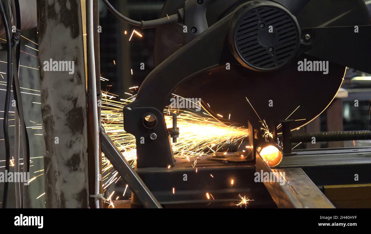Shot of working process on lathe with circular saw Stock Photo - Alamy