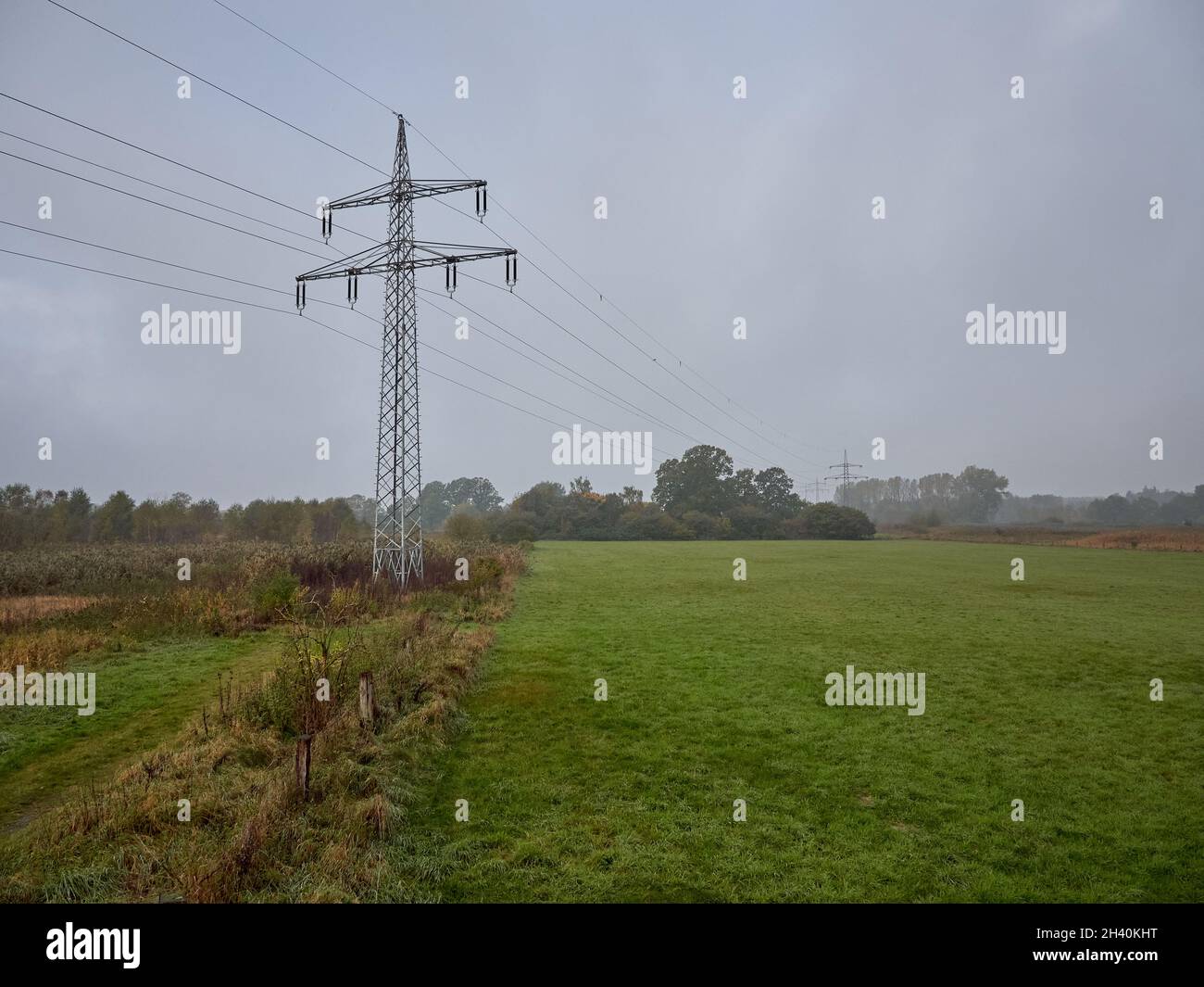 A High voltage pylons in nature Stock Photo - Alamy