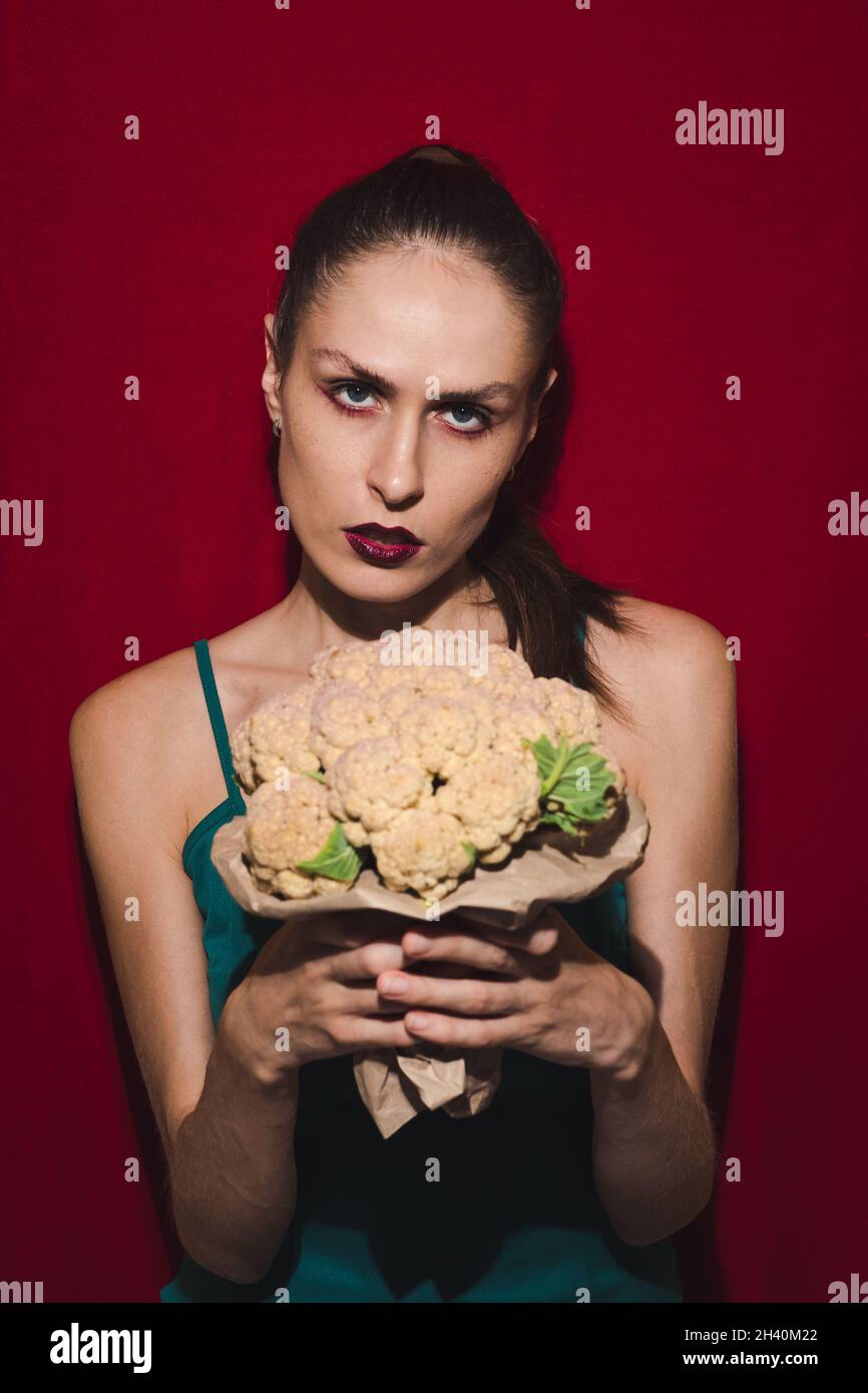 Cheeky model posing with cauliflower Stock Photo - Alamy
