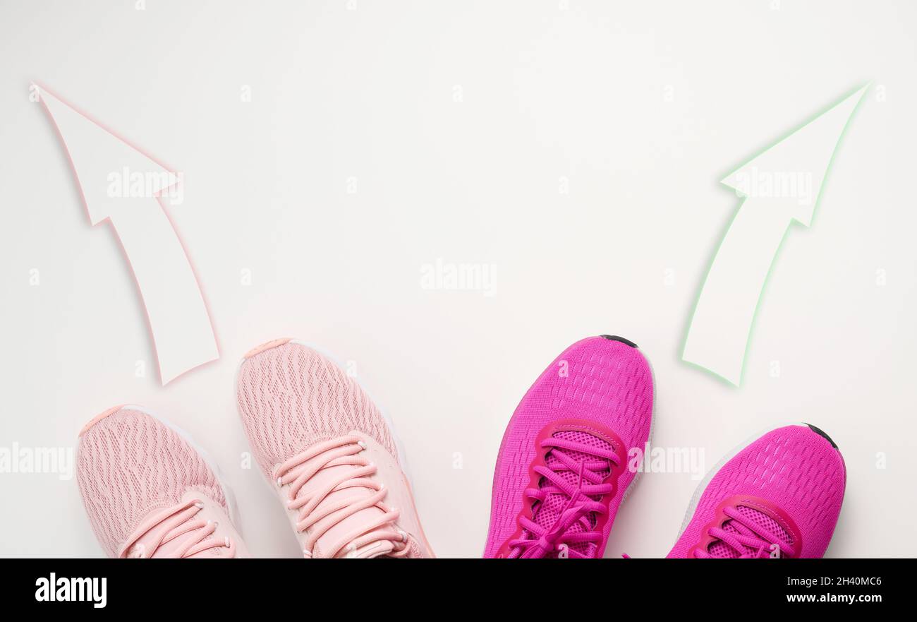 Two pairs feet in sneakers hi-res stock photography and images - Alamy