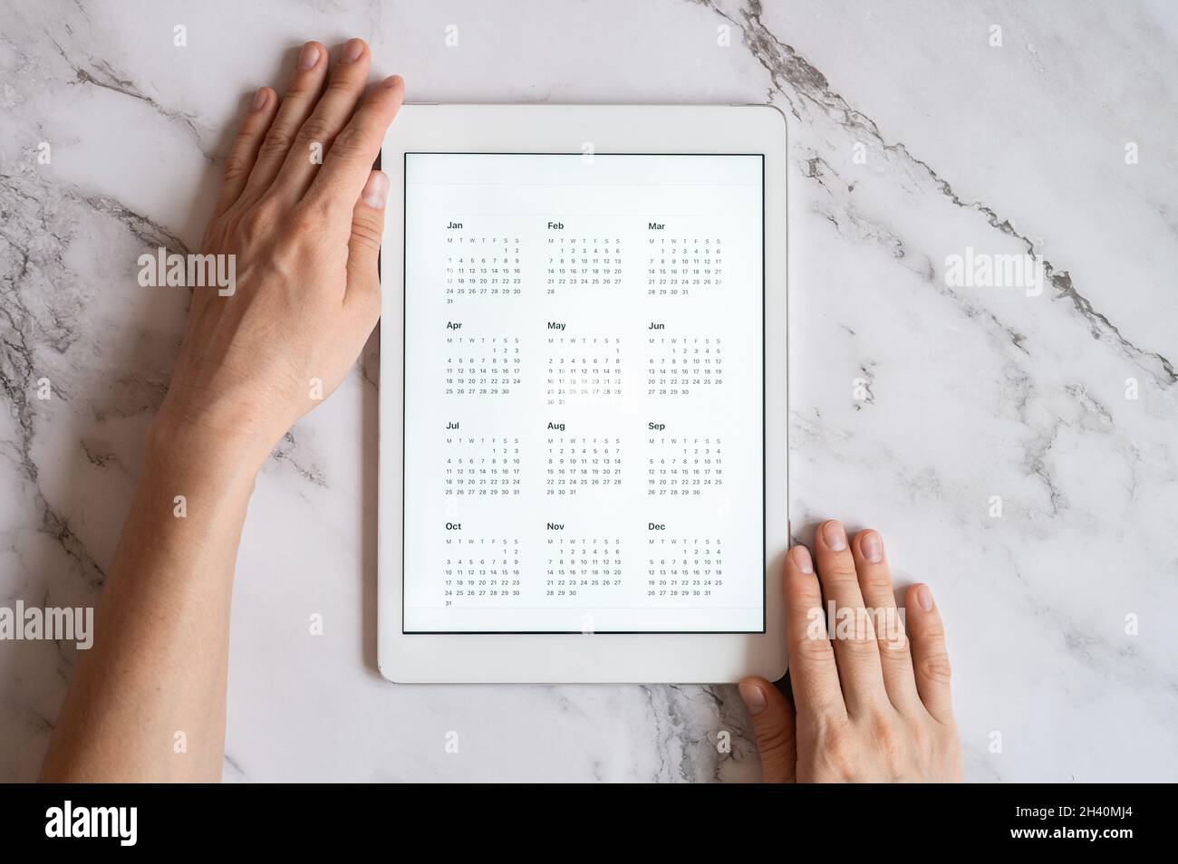 tablet computer with an open app of calendar for unspecified unknown ...