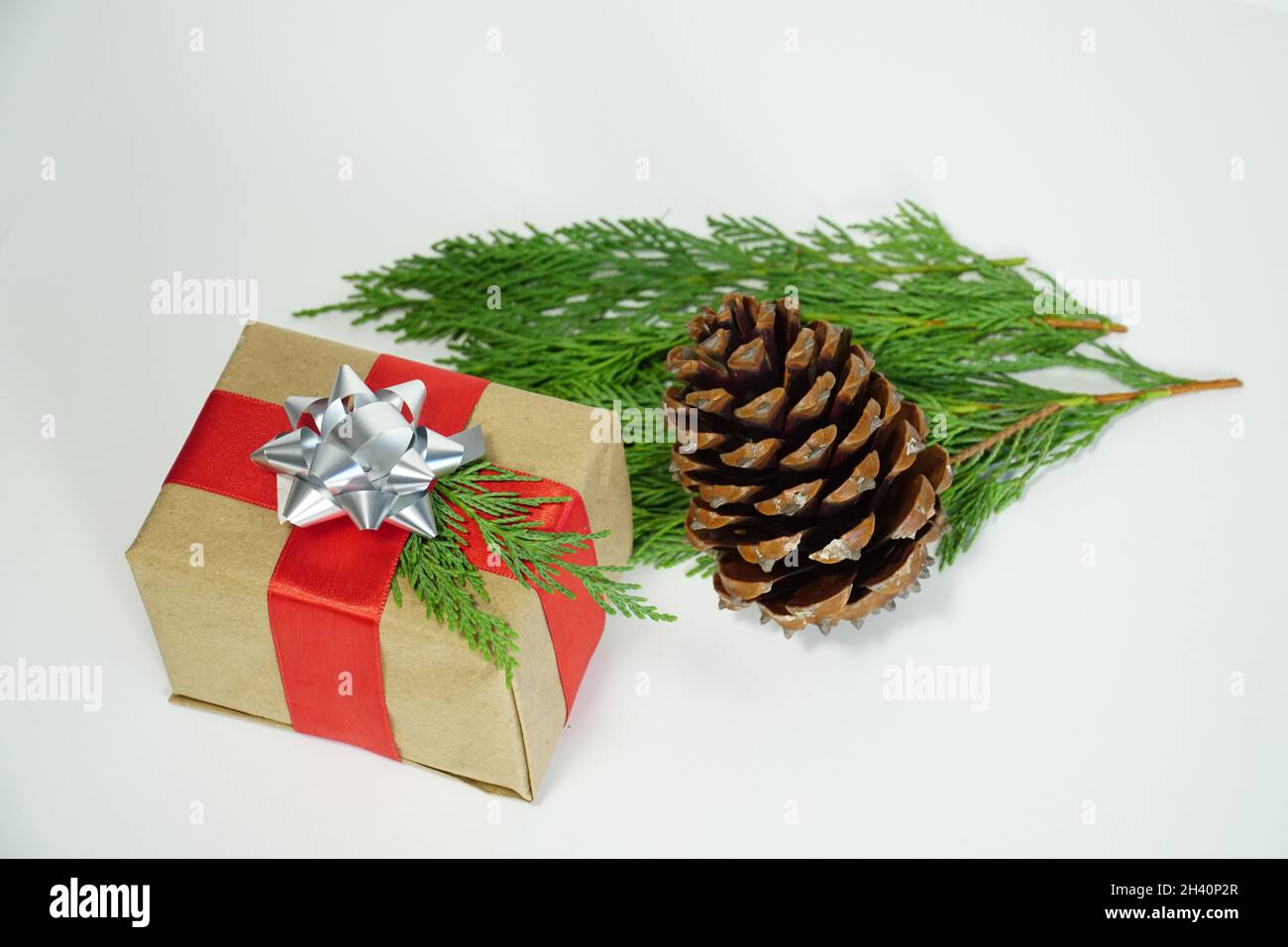Christmas gift top view concept idea with gift box pine cone or leaf on ...
