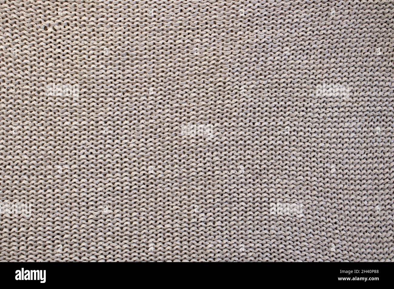 Soft light natural texture of knitted wool textile material background ...