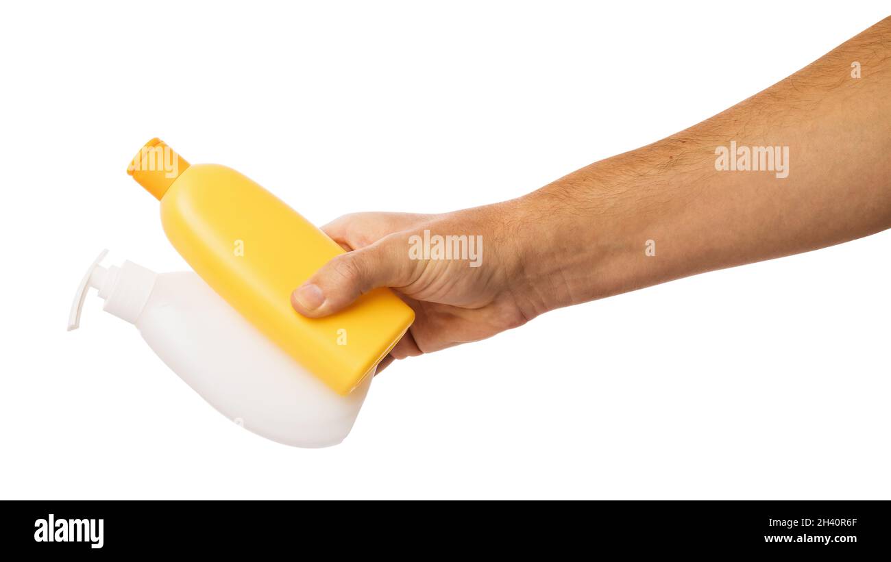 Man holds in hand hygiene products, soap and shampoo isolated on white ...