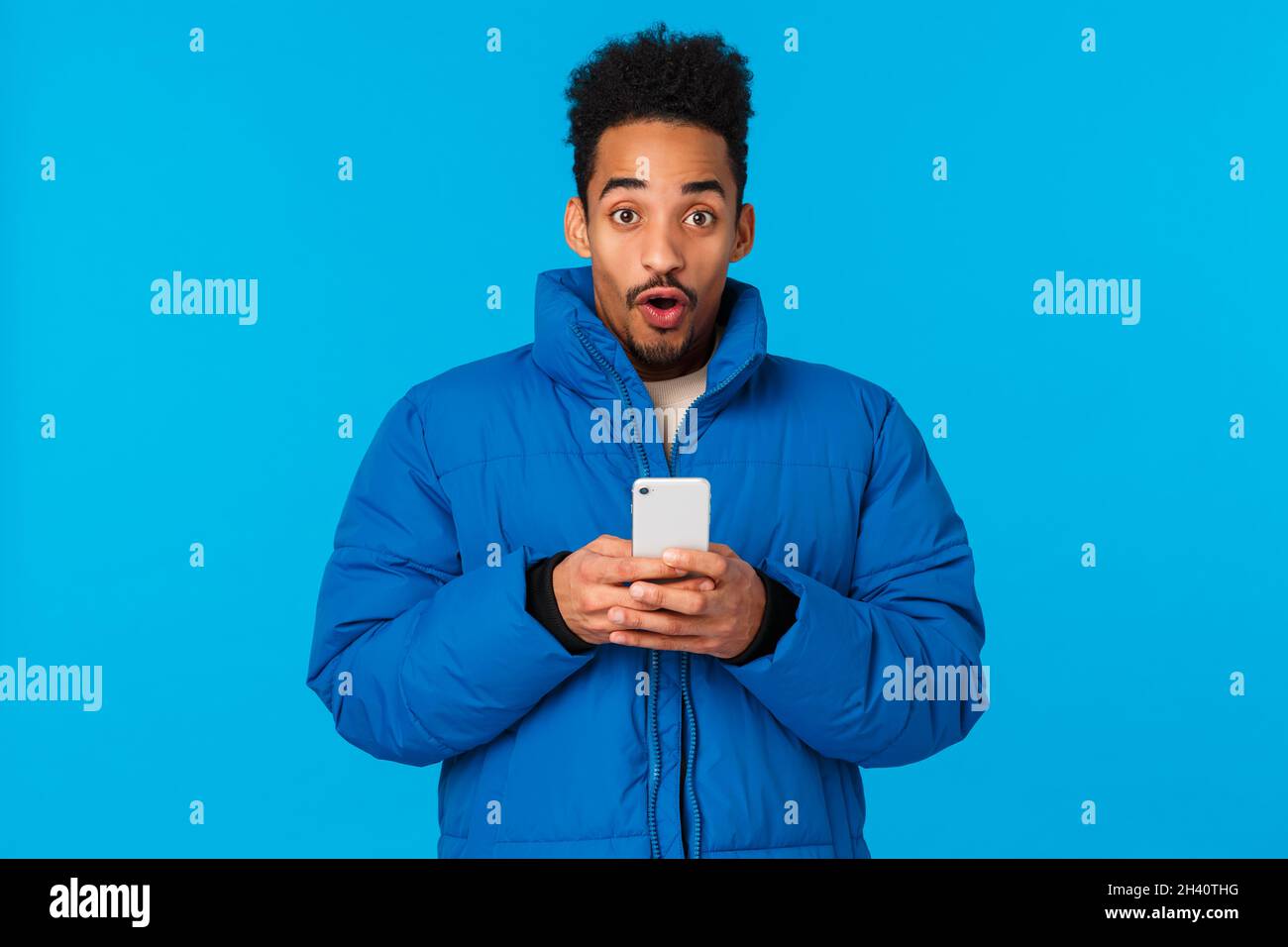 Astonished and impressed african american guy with moustache, afro ...