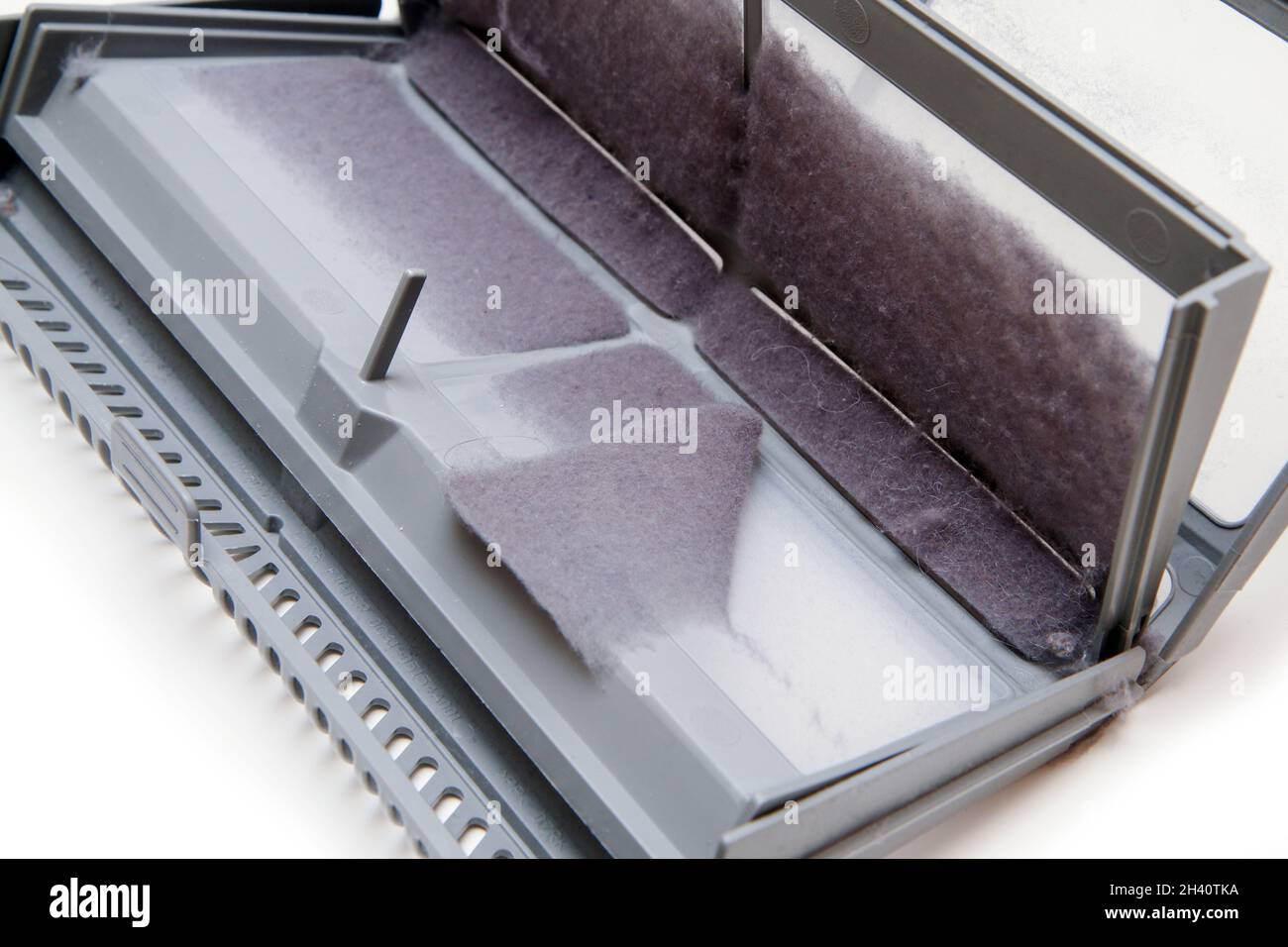 The filter from a drier full of dust and lumps making a layer on the ...