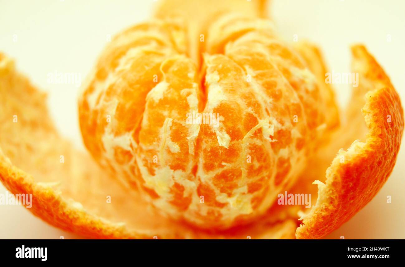Tangerine on its skin with white background Stock Photo - Alamy
