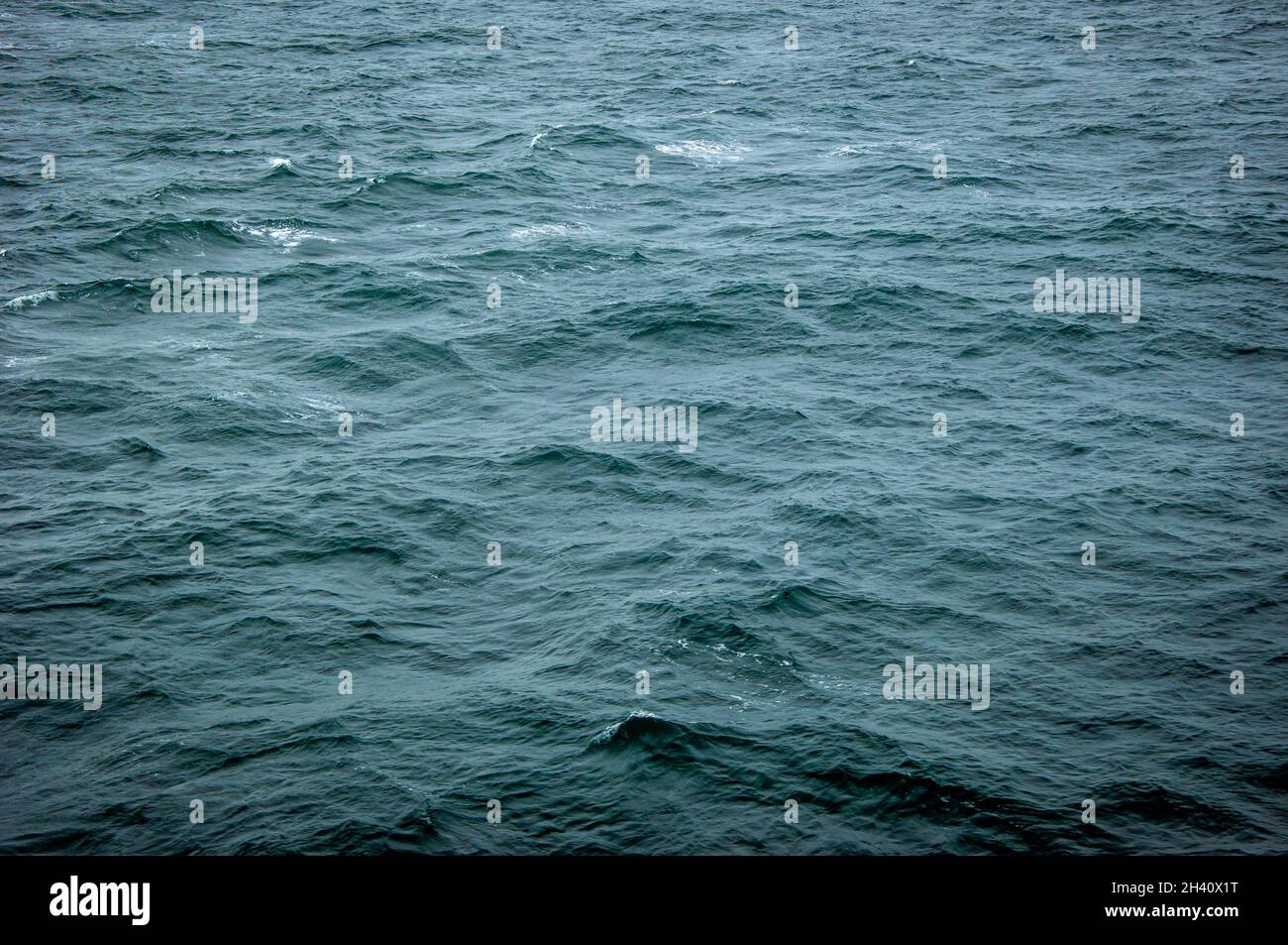 High angle shot taken of the surface of the sea taken from a ferry near ...