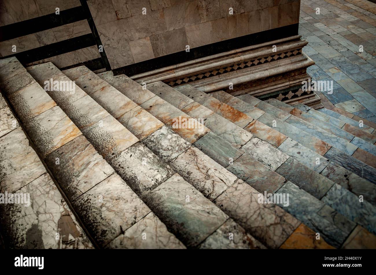 Marble steps of an ornate building leading up to bottom left of scene ...