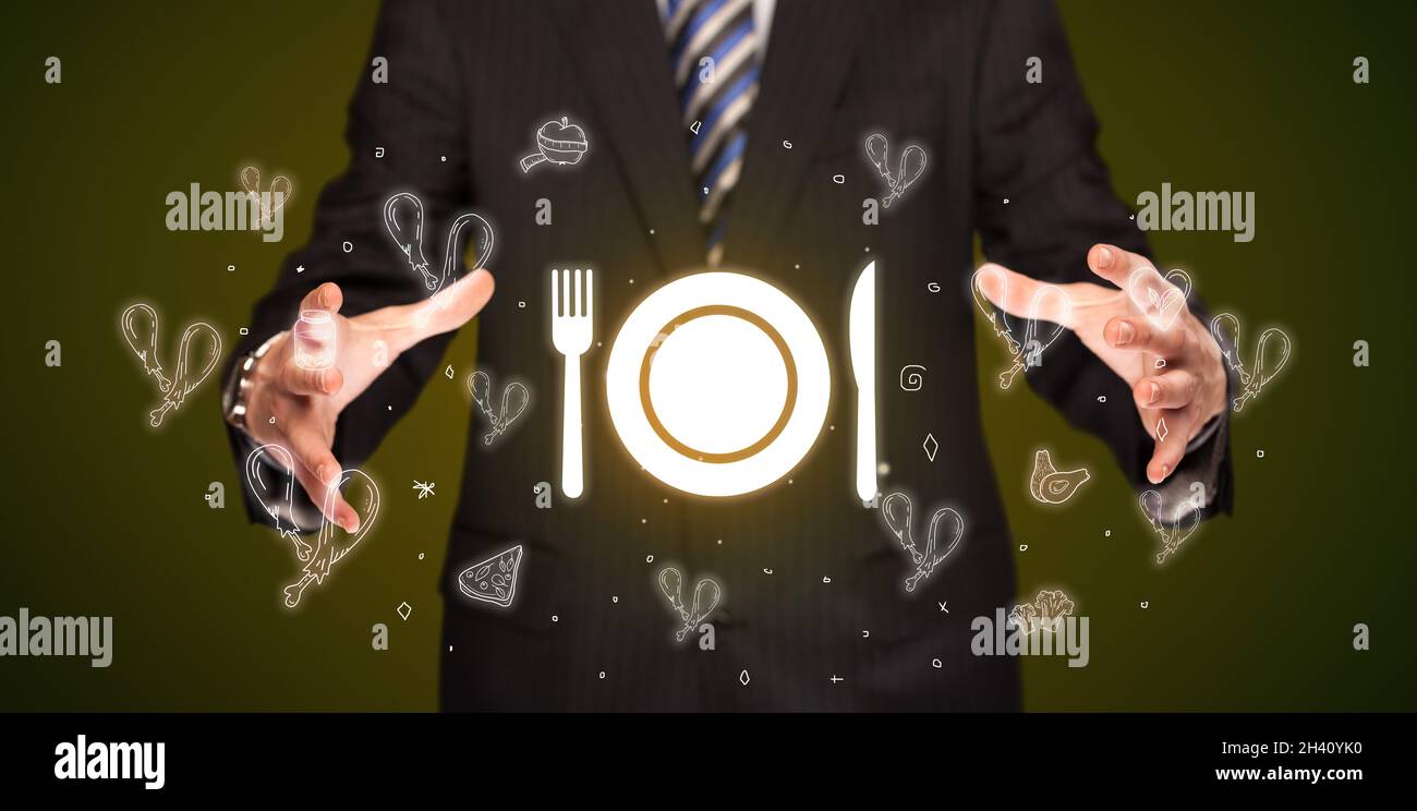 Hand holding food related icons Stock Photo - Alamy