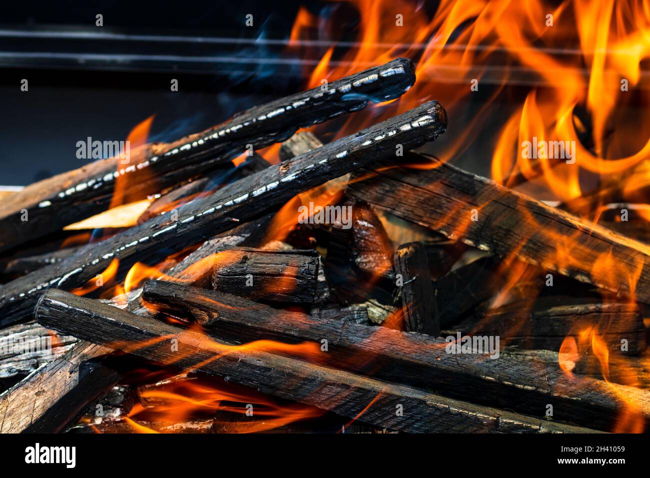 Barbecue grill pit with glowing and flaming hot open fire with red ...