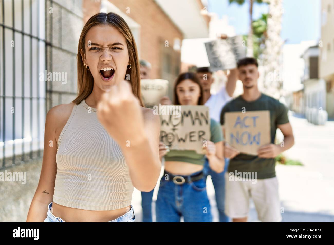 Group of people protesting and giving slogans at the street annoyed and ...