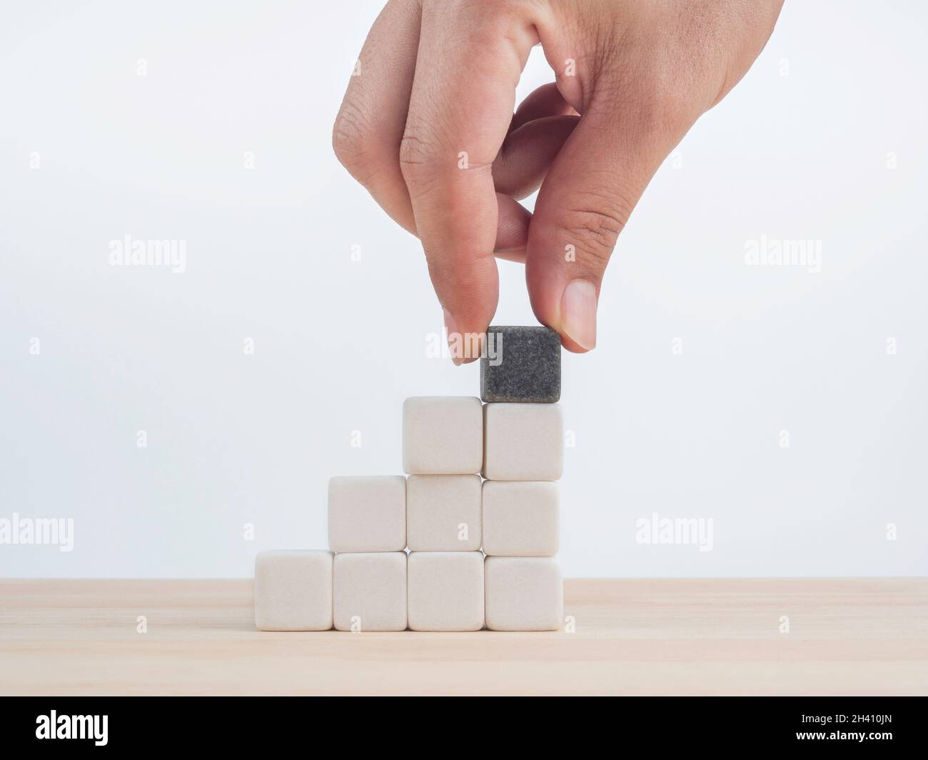 Business growth, benefit building process concept. Hand put the last ...