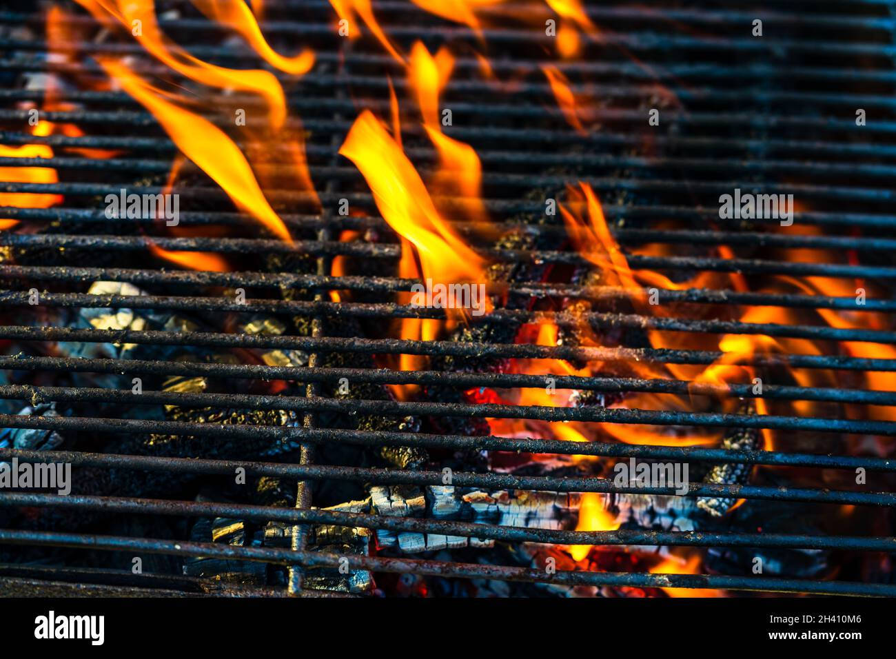 Empty hot charcoal barbecue grill with bright flame. Hot burning grill ...