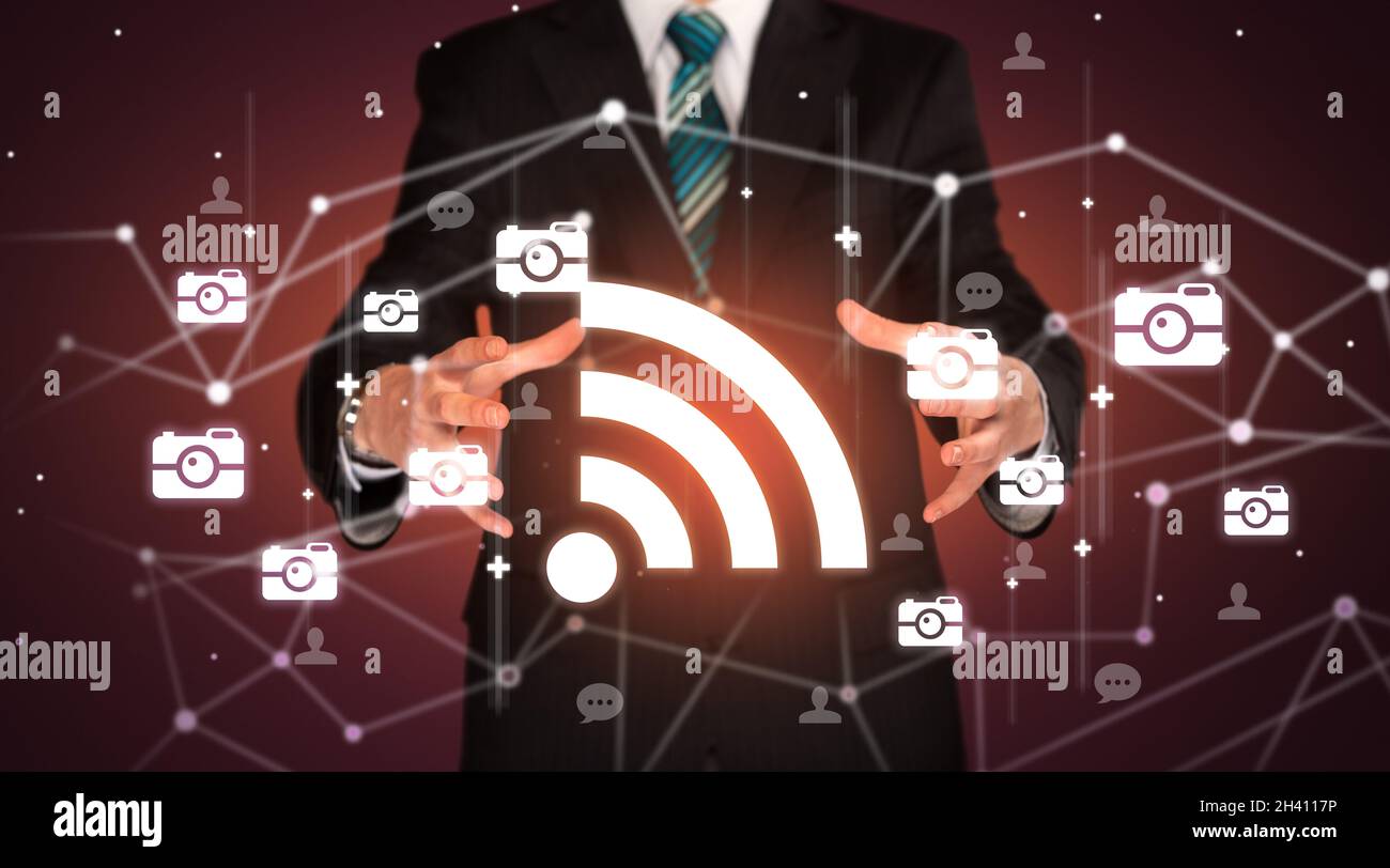 Hand holding social media icons Stock Photo - Alamy