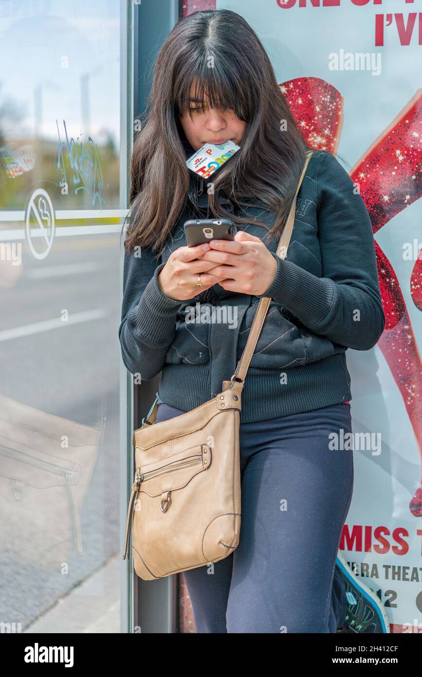 Texting bus stop hi-res stock photography and images - Alamy