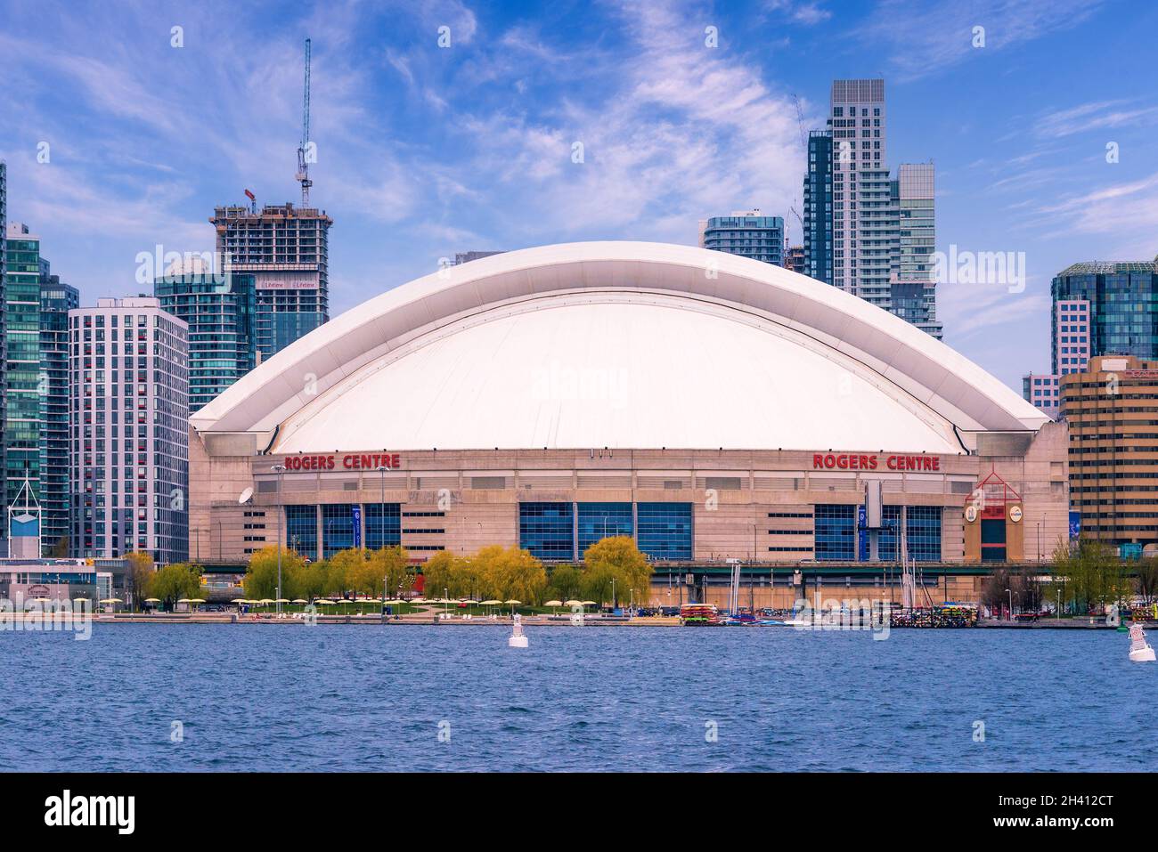 Toronto Skyline: Roger Center seen from lake Ontarion. The landmark is ...