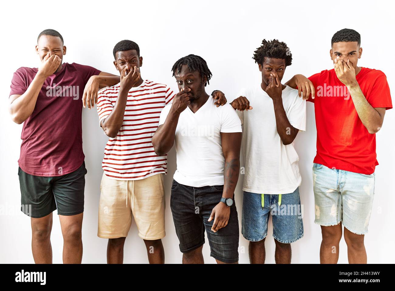 Young african group of friends standing together over isolated ...