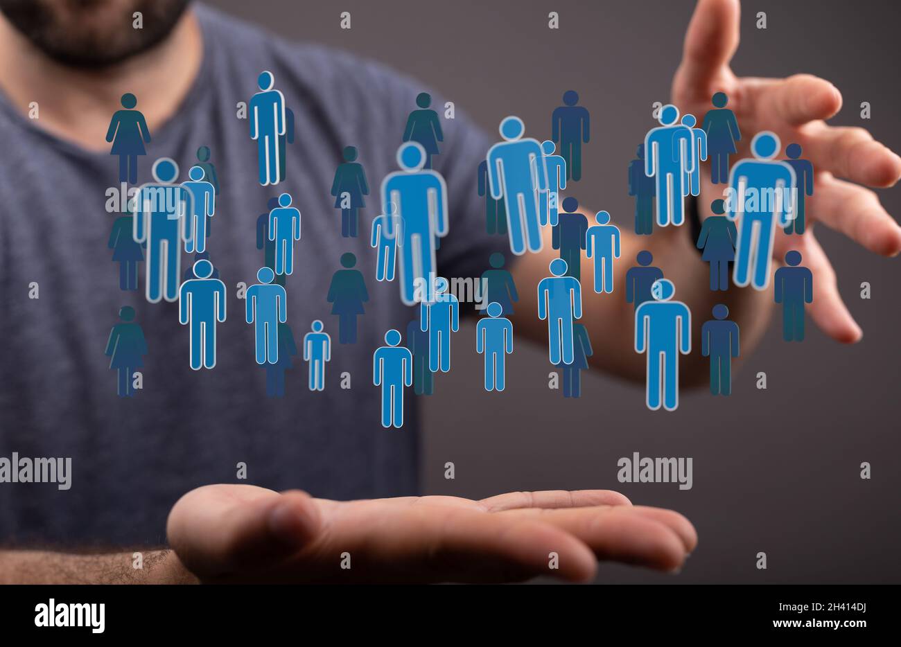 A 3D rendering of a group of floating people icons on a businessman's ...