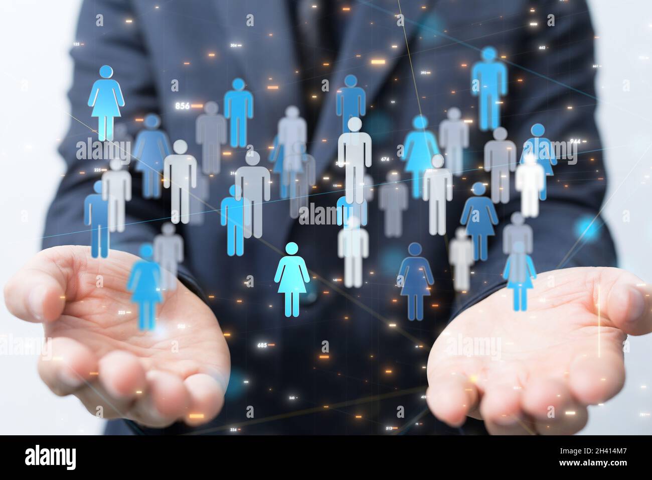 A 3D rendering of a group of floating people icons on a businessman's ...