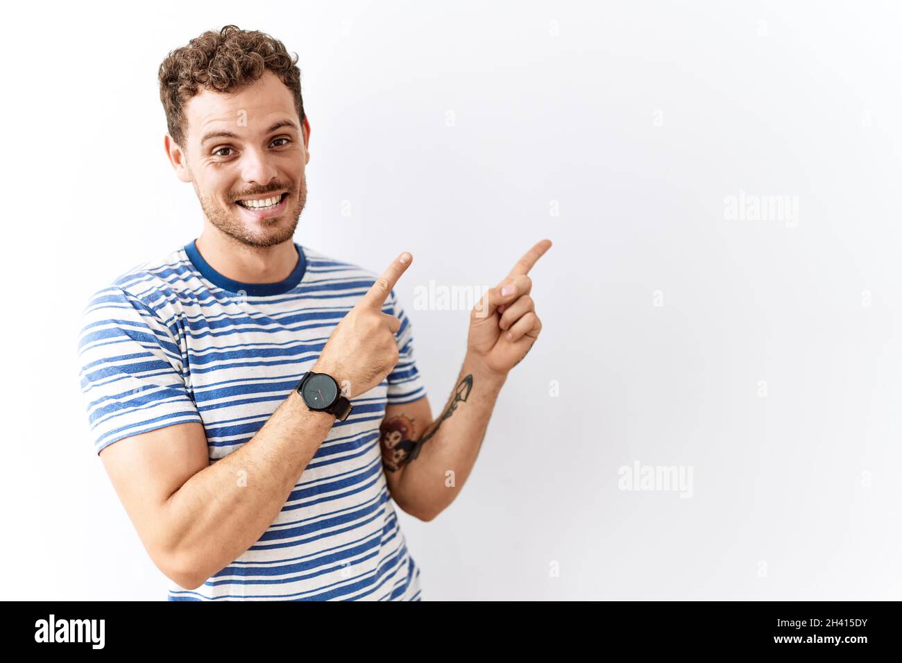 Handsome young man standing over isolated background smiling and ...