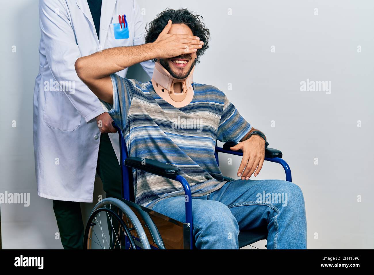 Handsome hispanic man sitting on wheelchair wearing neck collar smiling ...