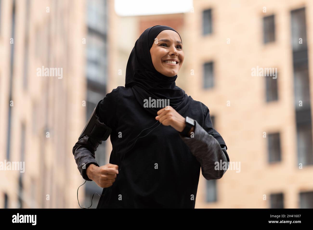 Active Lifestyle. Happy Young Muslim Woman In Modest Sportswear Jogging ...