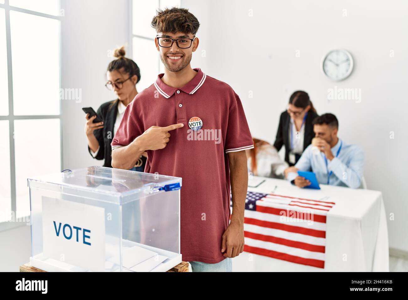 Young american voter man smiling happy pointing with finger to usa ...