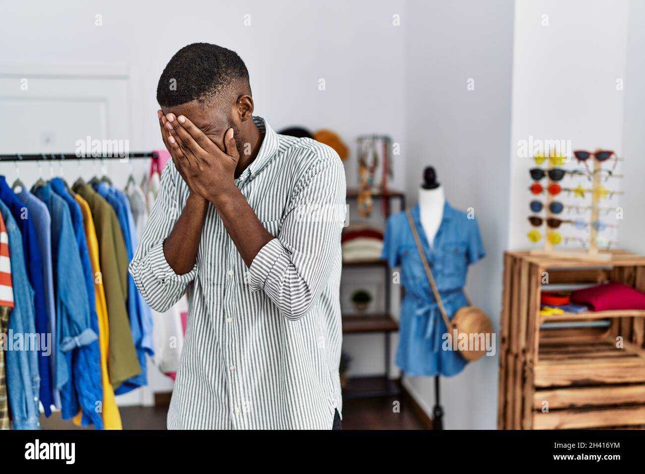 Young african american man working as manager at retail boutique with ...