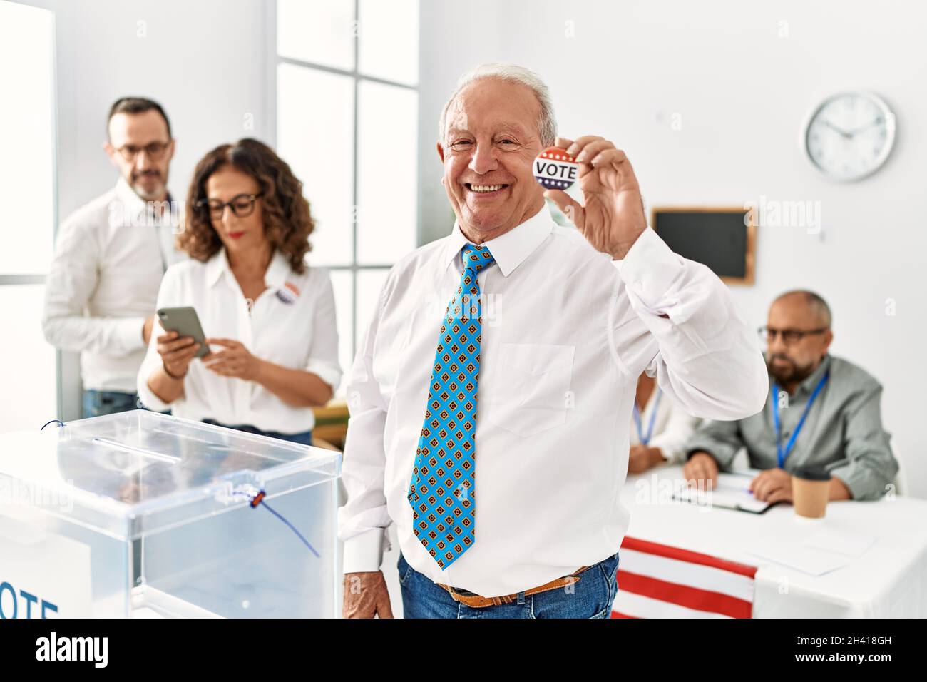 Middle age american voter man smiling happy holding usa badge at vote ...