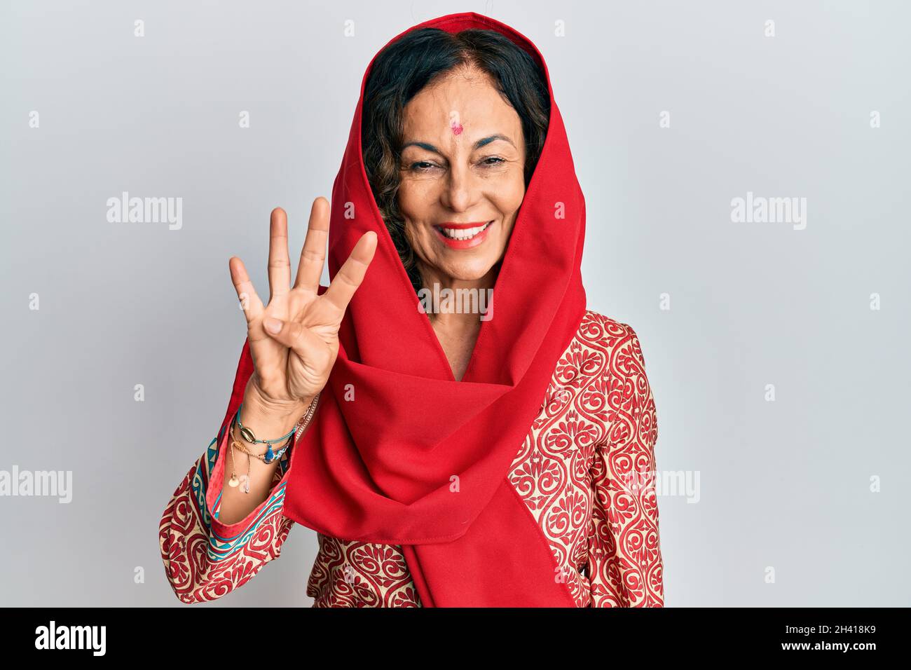 Middle age hispanic woman wearing tradition sherwani saree clothes ...