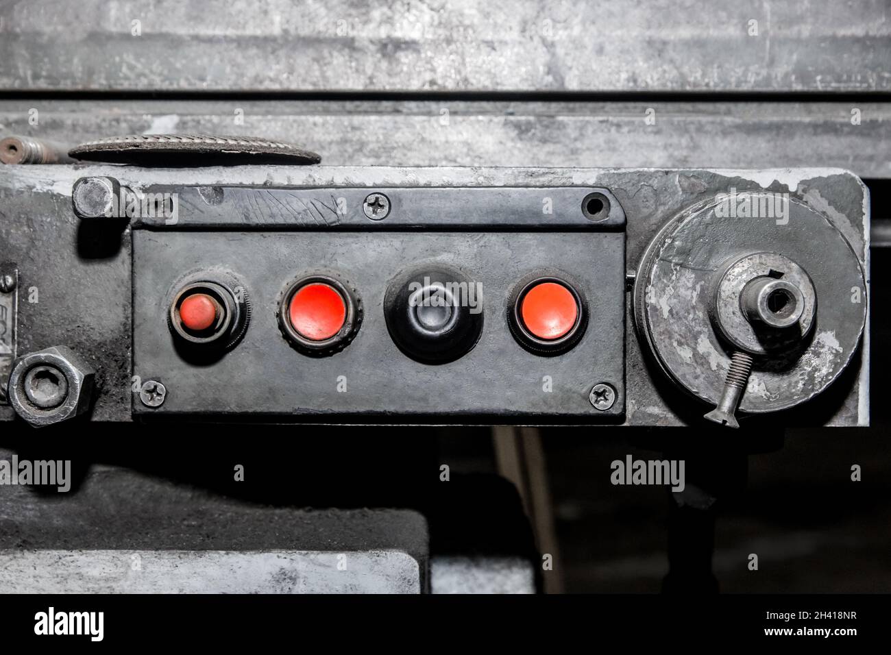 Dirty and old control panel with red buttons system for industrial ...