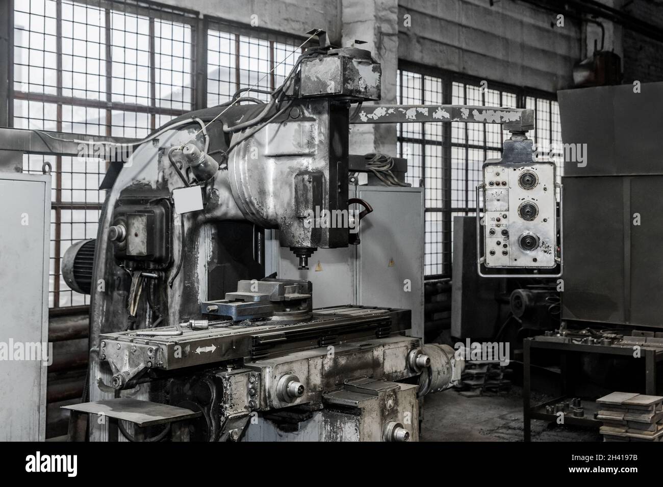 Old milling machine with control panel equipment and tools for metal ...