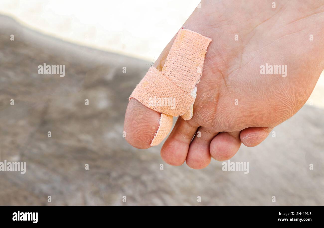 A close up of bandage on boy big toe. intended selective focused Stock ...