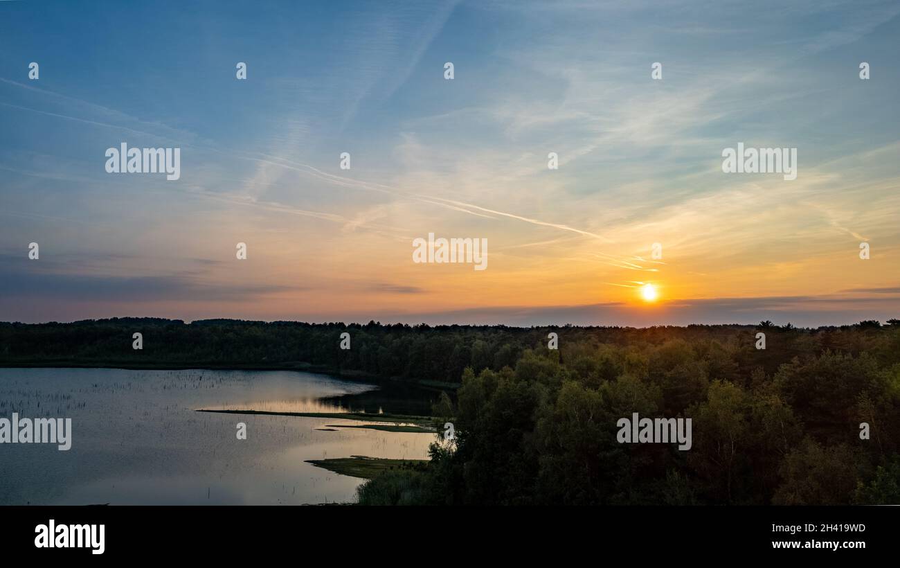 Aerial view of a rural landscape during sunrise in Belgium. Rural farm ...