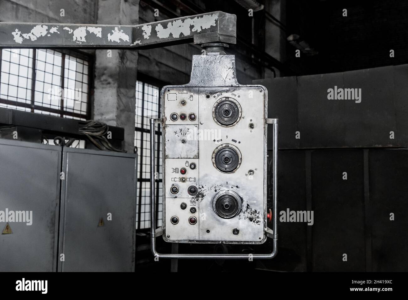 Old control panel of milling machine equipment in the workshop of ...
