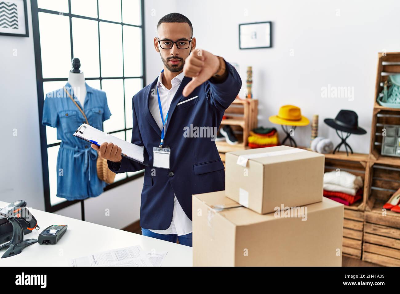 African american man working as manager at retail boutique looking ...