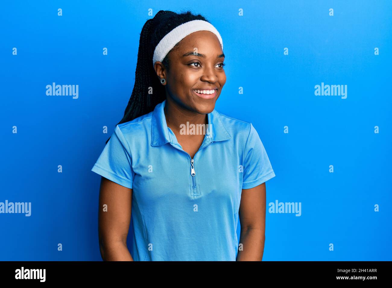 African american woman with braided hair wearing tennis player uniform ...