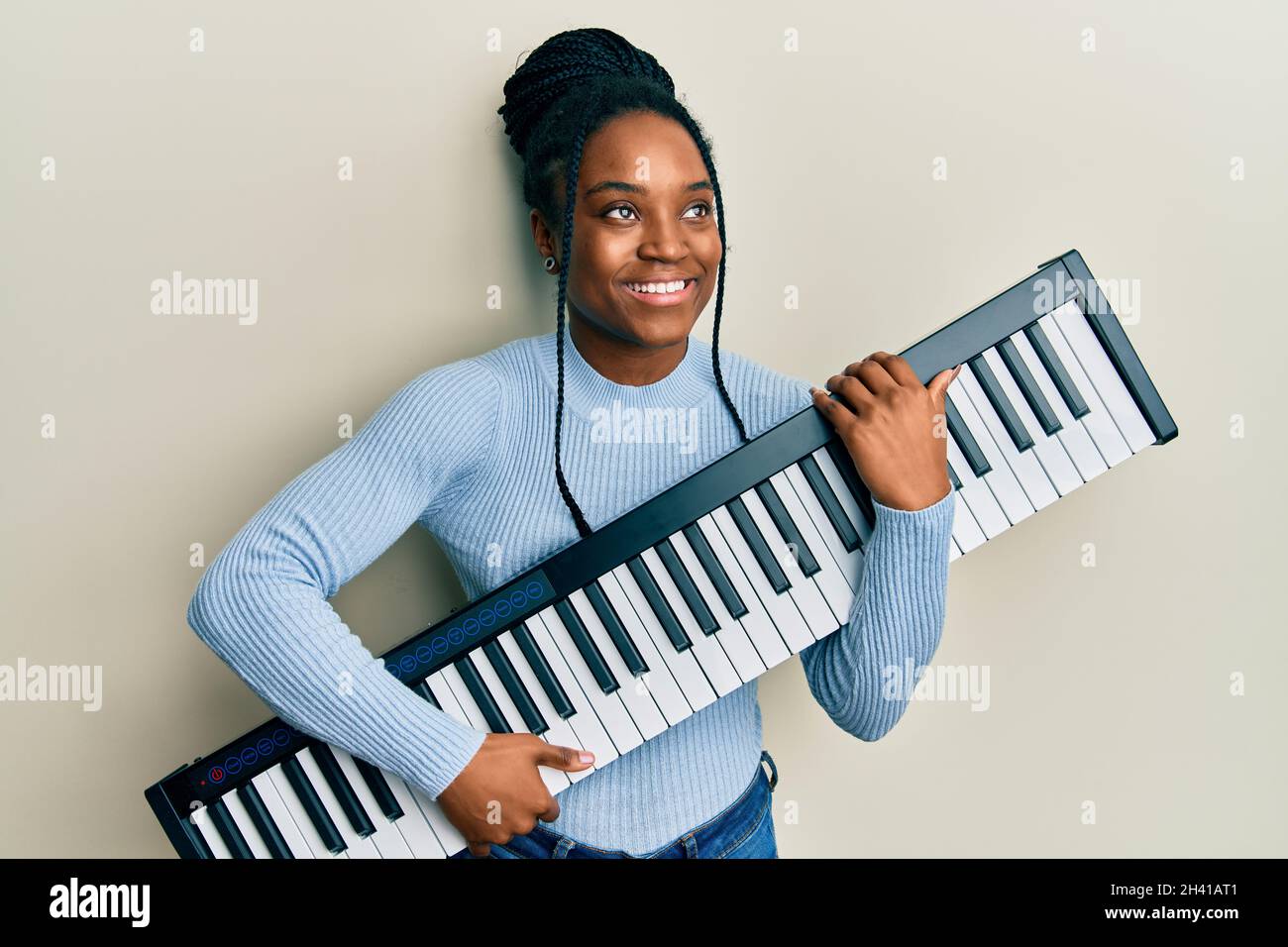 Musician girl with braided hair hi-res stock photography and images - Alamy
