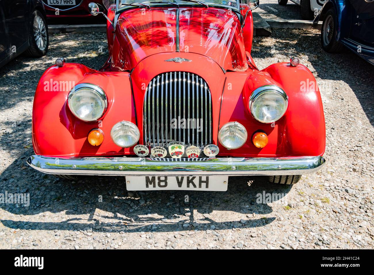 front view of red Morgan +4 motor car Stock Photo - Alamy