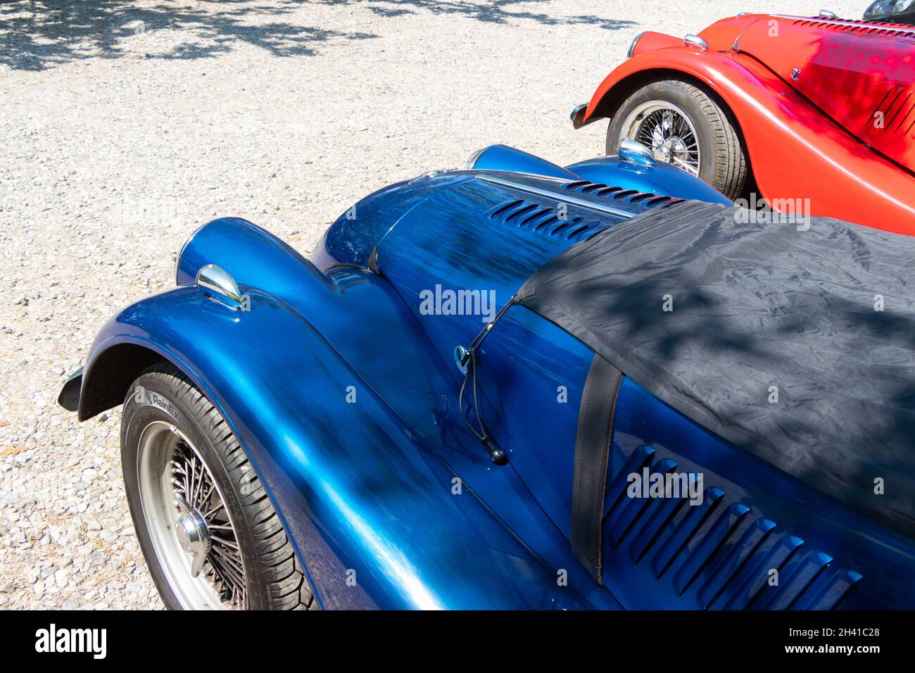 bonnets of red and blue morgan motor cars Stock Photo - Alamy