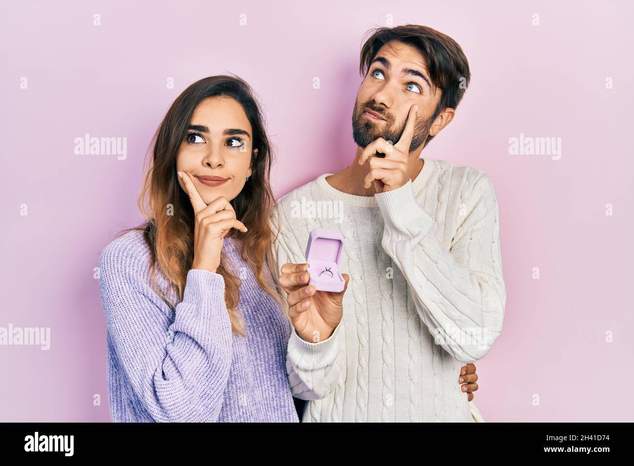 Beautiful couple of boyfriend and girlfriend holding engagement ring ...