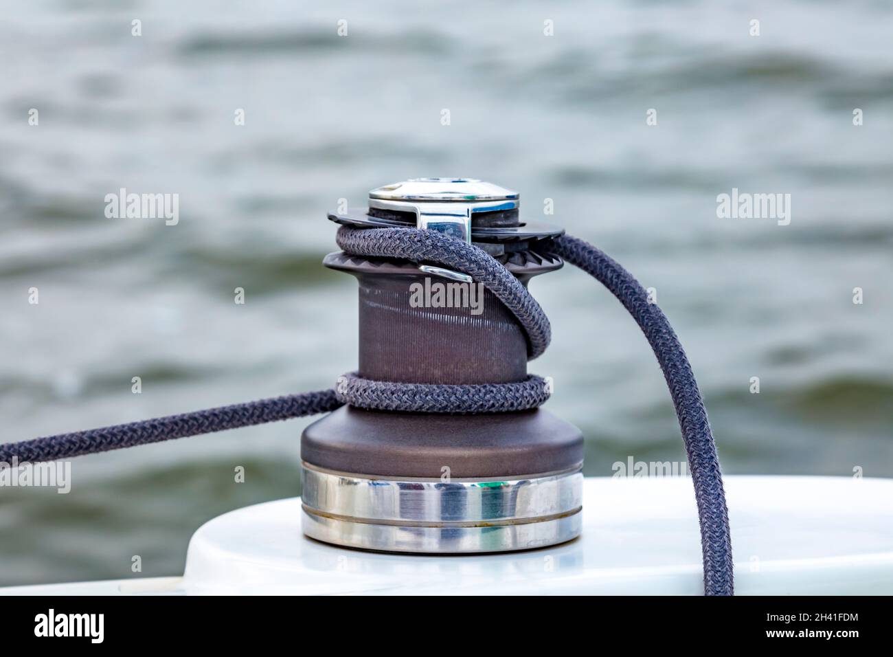 Sailing boat yacht sheet winch with rope closeup Stock Photo - Alamy
