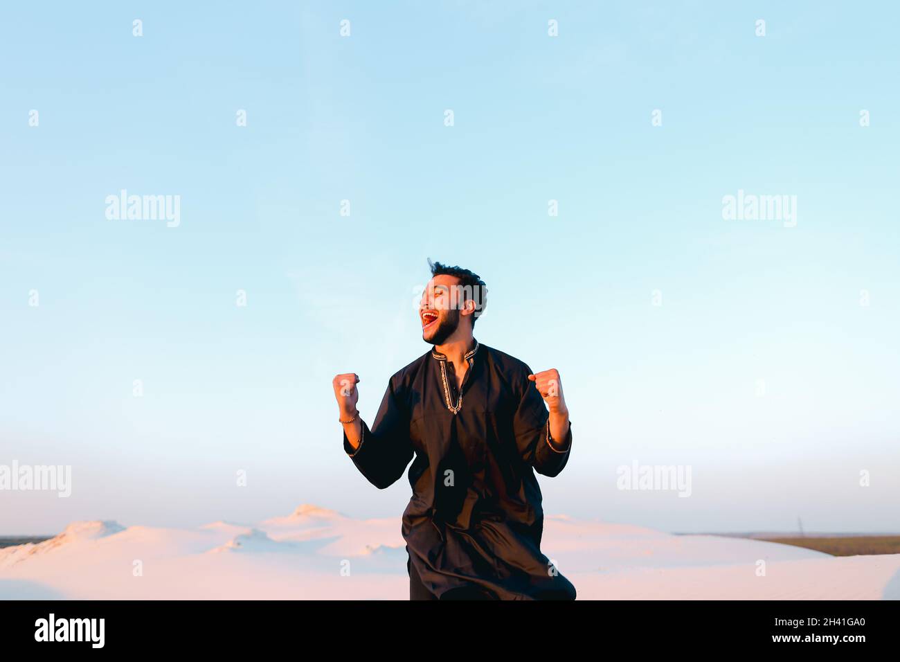 Happy portrait of male Arab, who smiles and rejoices in life, standing ...