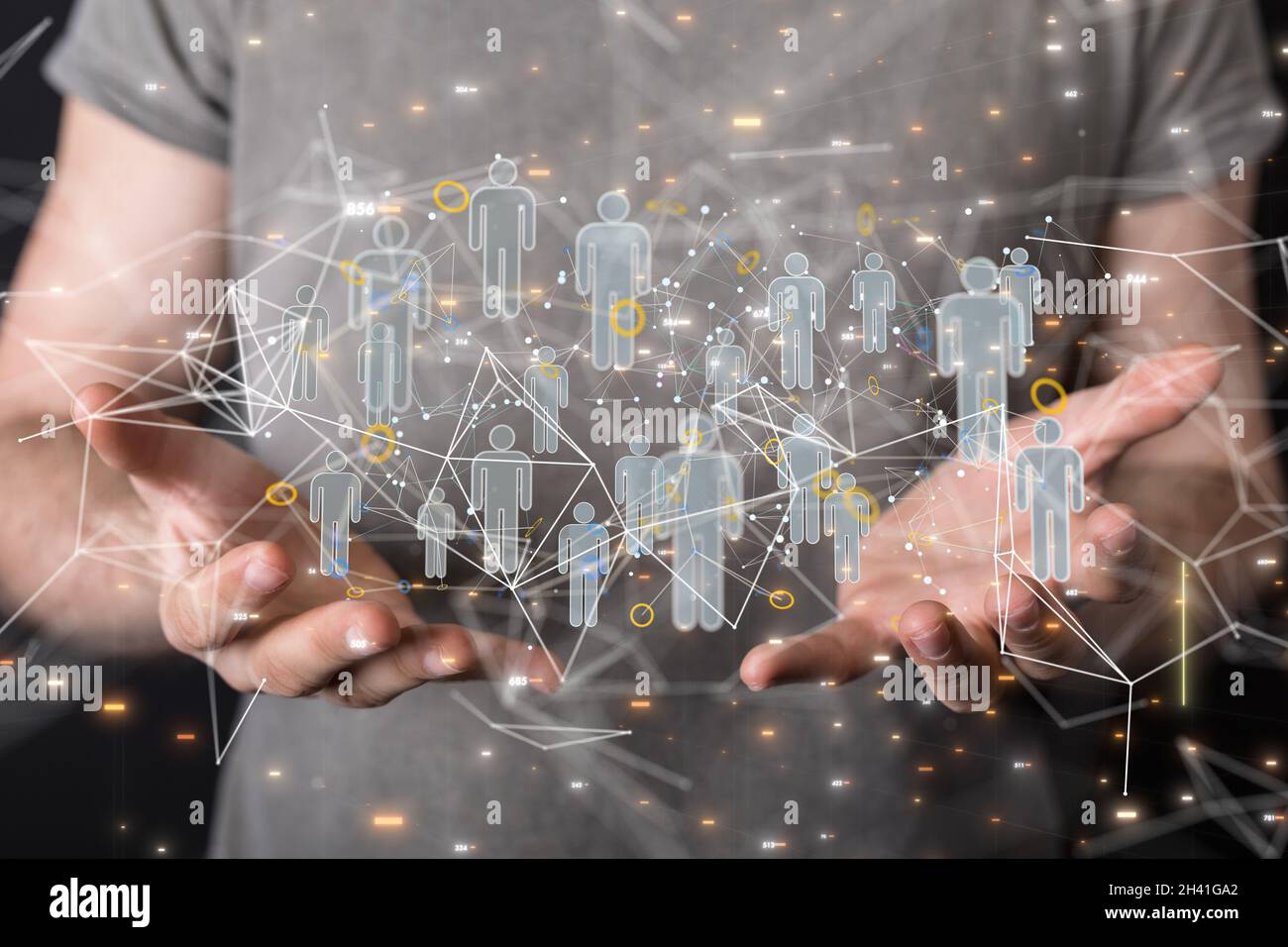 A 3D rendering of a group of floating people icons on a businessman's ...