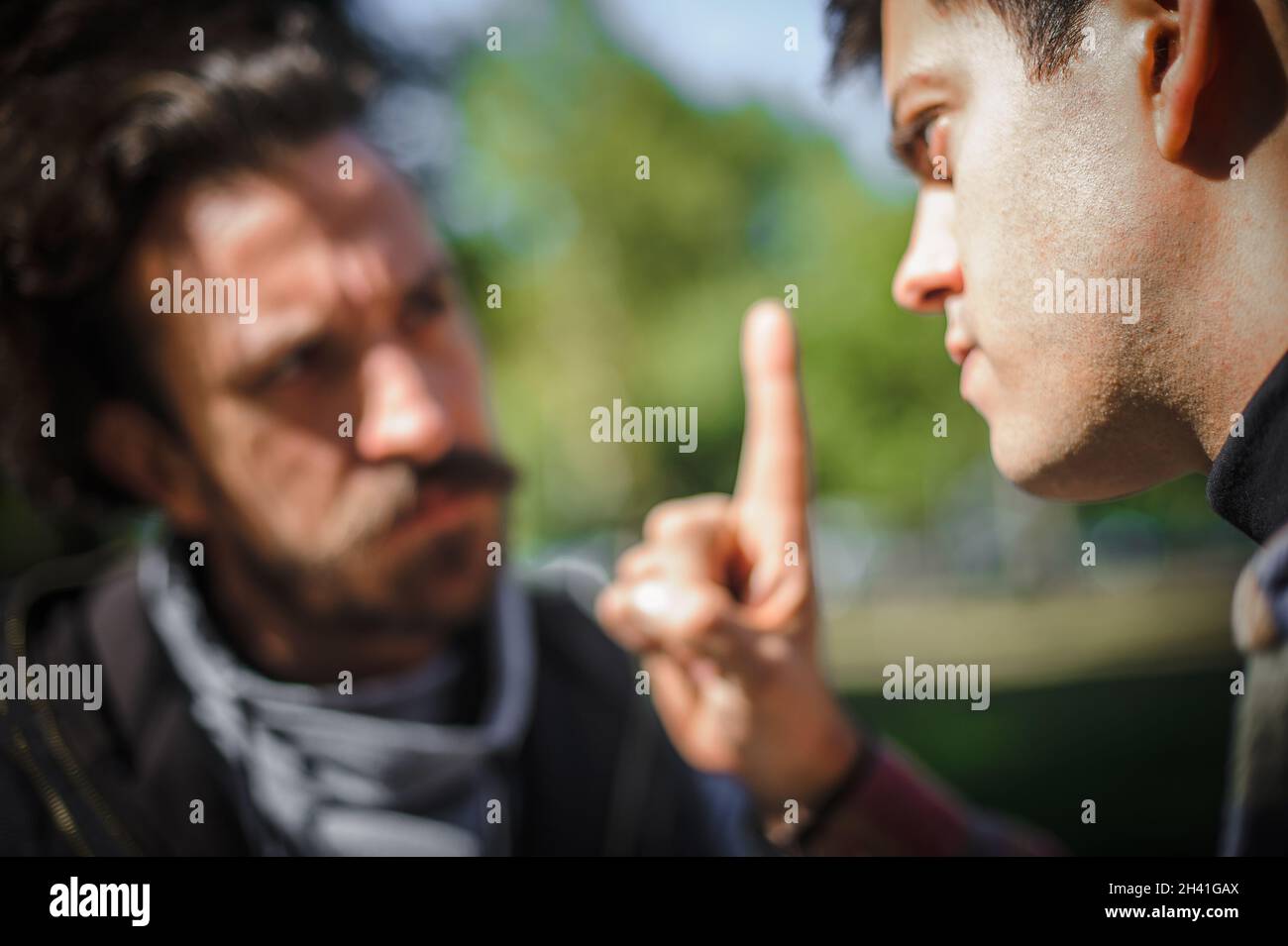 Close-up finger pointing of two very angry, nervous and upset men in an ...