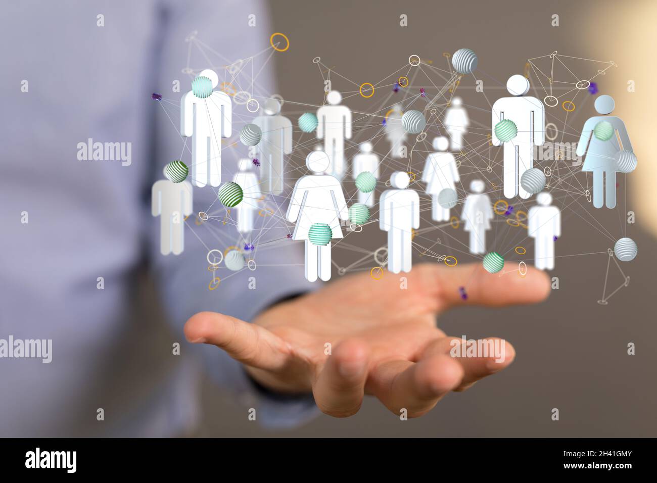 A 3D rendering of a group of floating people icons on a businessman's ...