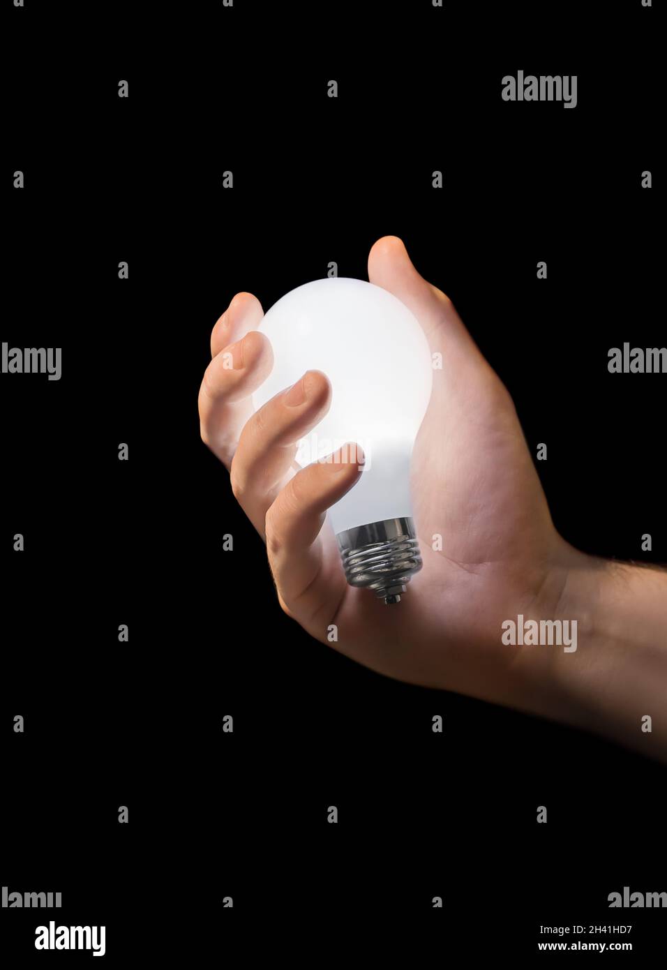 Lighting lamp in hand Stock Photo - Alamy